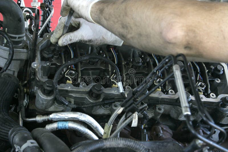 Mechanic working on engine stock image. Image of motor - 7089861