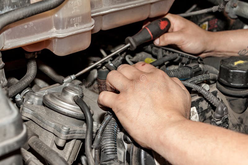 Mechanic working on engine stock photo. Image of exhibition - 57546394