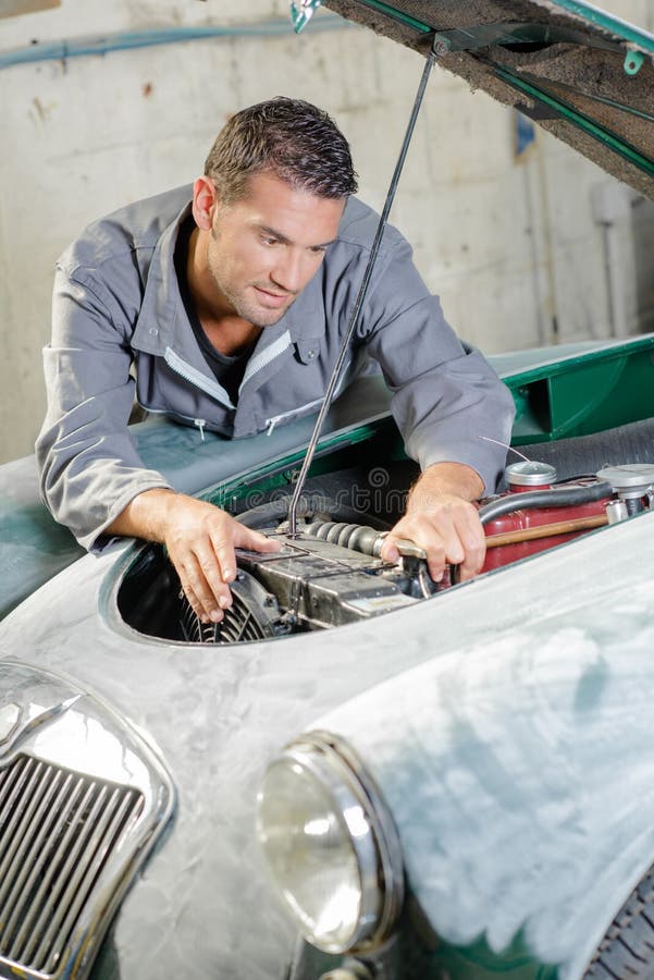 Mechanic Working on Engine Classic Car Stock Image - Image of vintage ...
