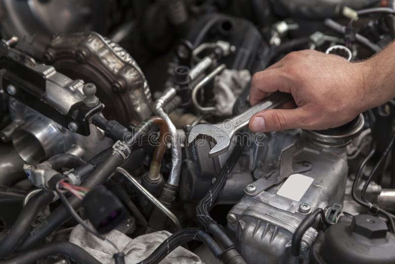 Mechanic Working on Engine Repairs Stock Photo - Image of shop, auto ...
