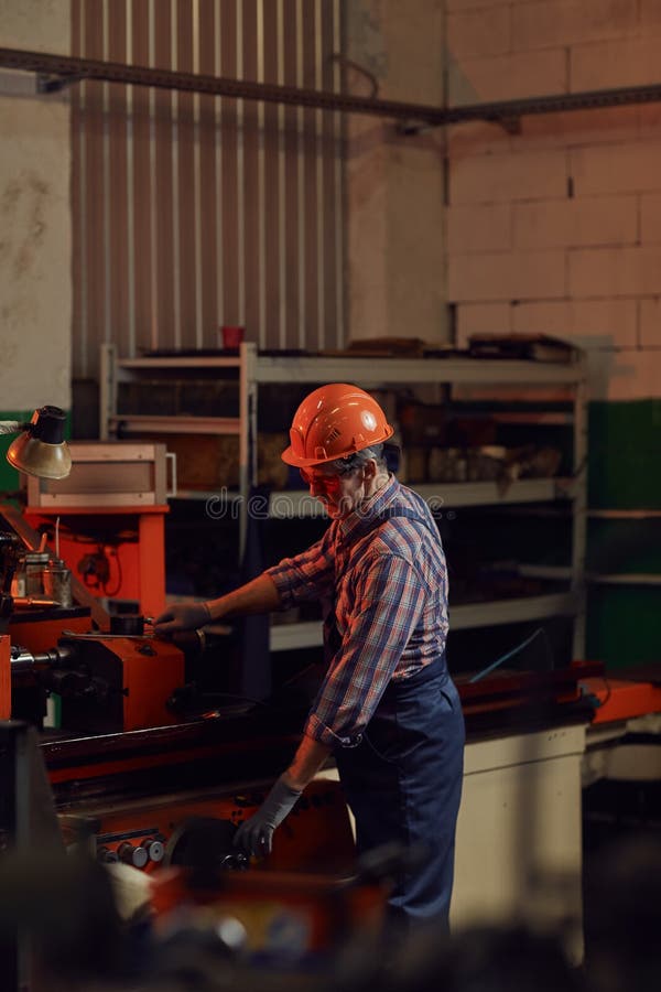 Mechanic Working at the Lathe Stock Photo - Image of machinist, hardhat ...