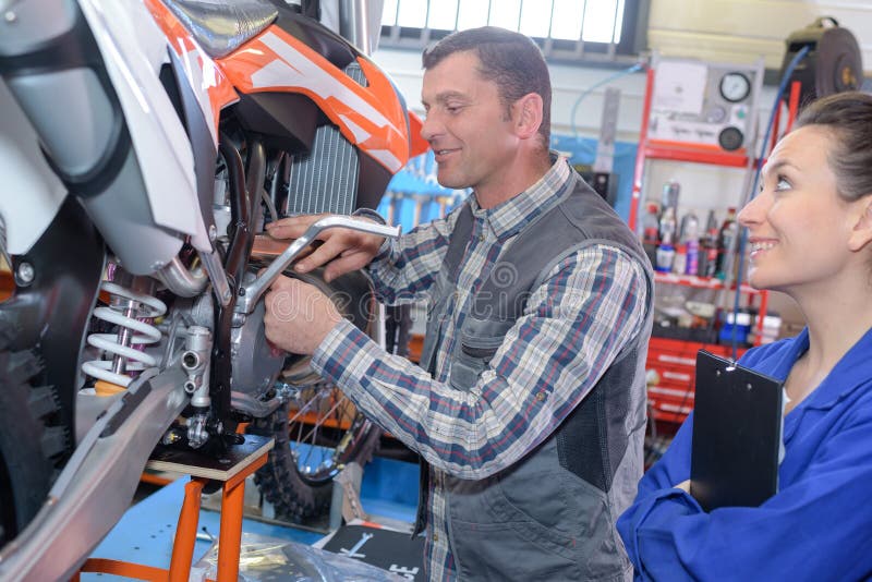 Mechanic Working on Motorcycle Stock Photo - Image of trial, trail ...