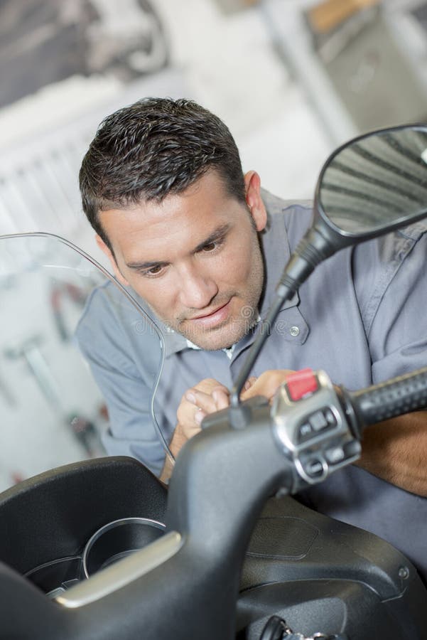 Mechanic Working on Scooter Stock Photo - Image of maintenance, hand ...