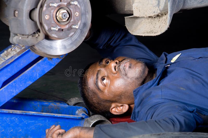 Mechanic Working Under a Car Stock Image - Image of fixing, industrial ...
