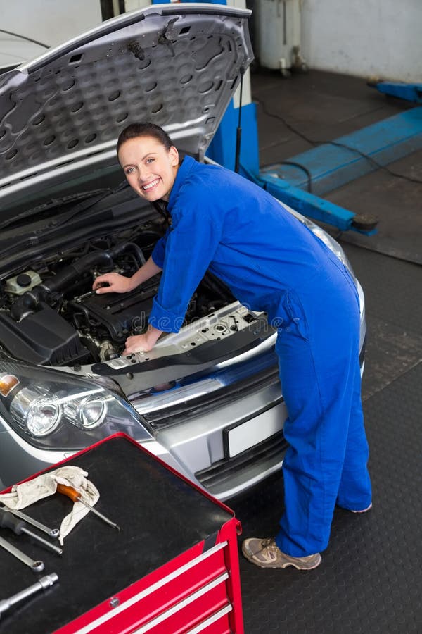 Mechanic Working Under the Hood Stock Photo - Image of wear, hood: 49284336