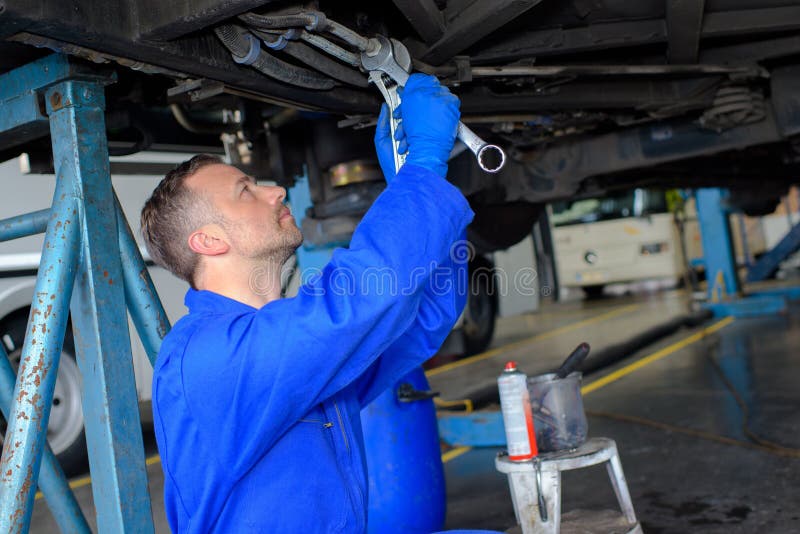 Mechanic Working Underneath Car Stock Image - Image of looking ...