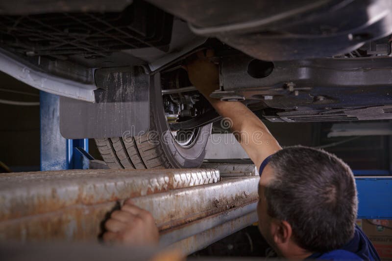Mechanic Works on a Car in Body Shop Stock Image - Image of breakdown ...