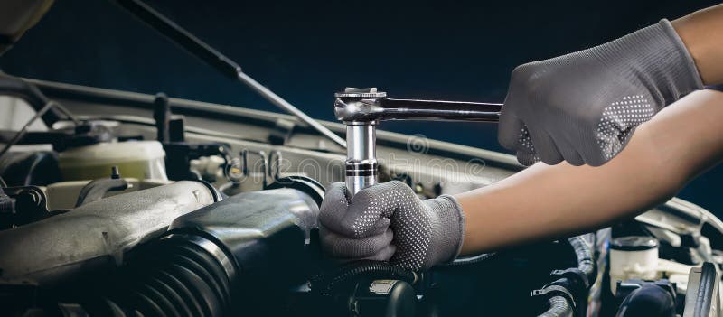 The Mechanic Works on the Engine of the Car in the Garage, Car Repair ...