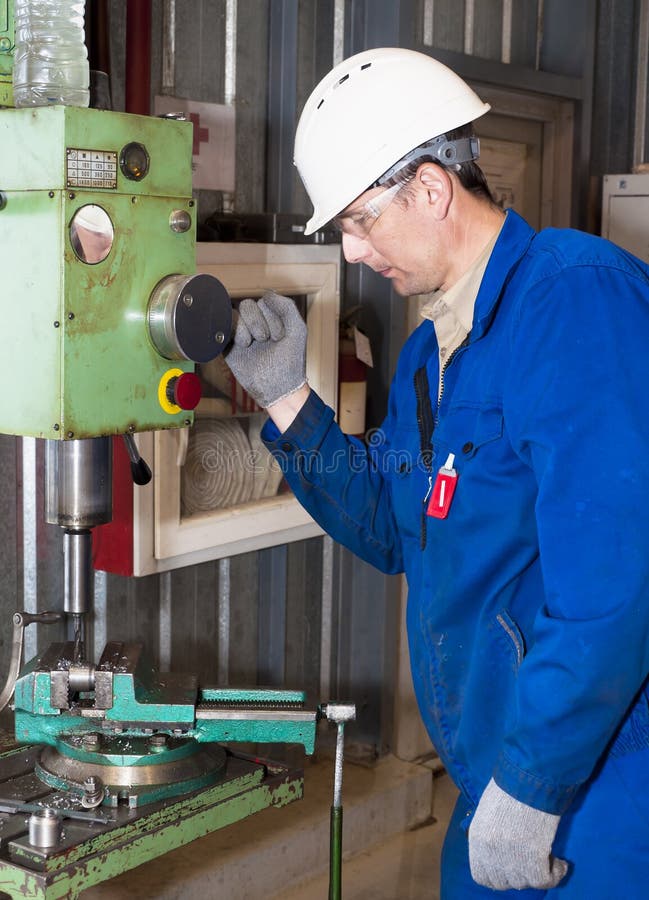 The Mechanic Works at the Machine Stock Image - Image of metal ...