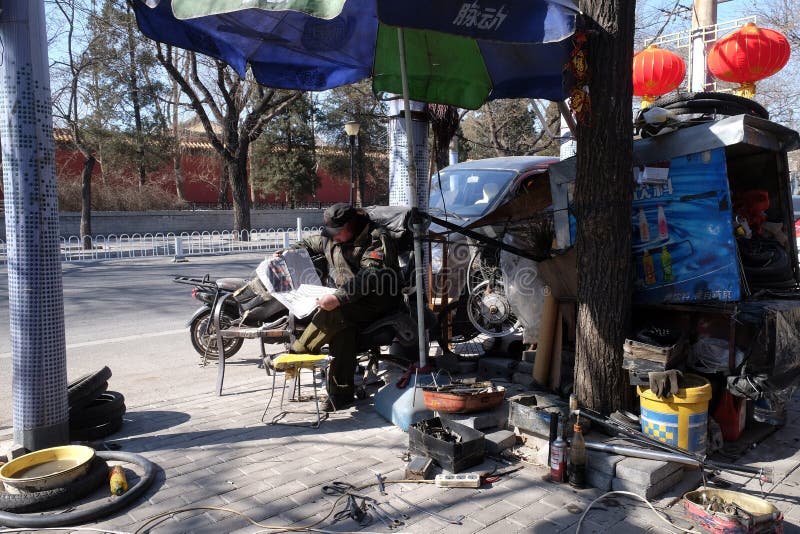 Mechanic at Workshop on Street in Beijing Editorial Photography - Image ...