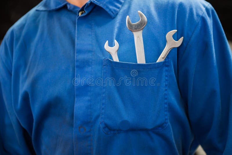 Mechanic with Wrenches in Pocket Stock Image - Image of indoors ...