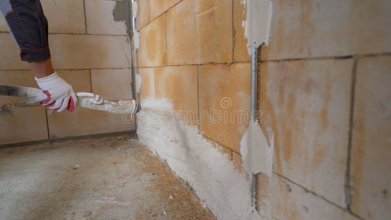 Mechanical Application of Mortar on the Wall. Application of Mortar on ...