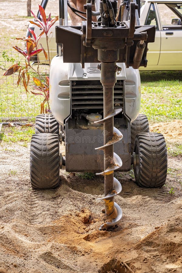 A Mechanical Auger Digging a Post Hole Stock Photo - Image of ...