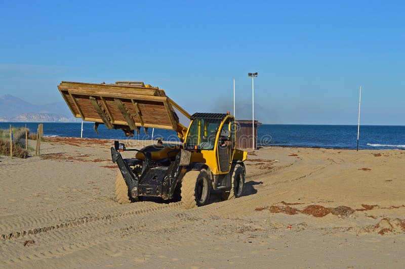 A Mechanical Digger Clearing a Beach Stock Photo - Image of beach, deep ...