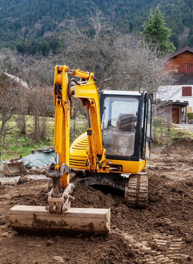 Mechanical Digger in the Garden for Landscaping Stock Image - Image of ...