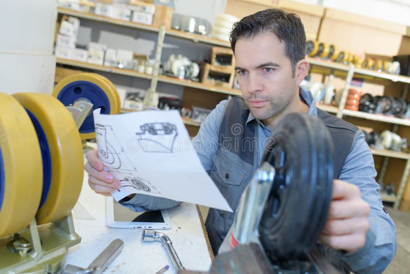 Mechanical Engineer Checking Technical Drawings Stock Photo - Image of ...