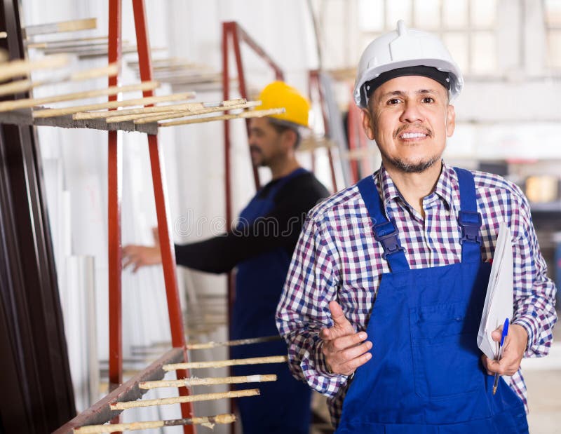 Mechanical Engineer Inspecting the Work of Labour at Factory Stock ...