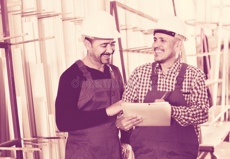 Mechanical Engineer Inspecting the Work of Labour at Factory Stock ...