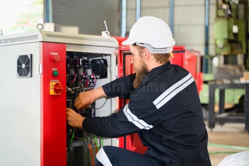 Mechanical Engineer Repairing Engine Machine at Factory Stock Photo ...