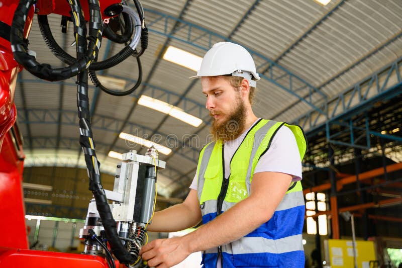 Mechanical Engineer Repairing Engine Machine at Factory Stock Photo ...