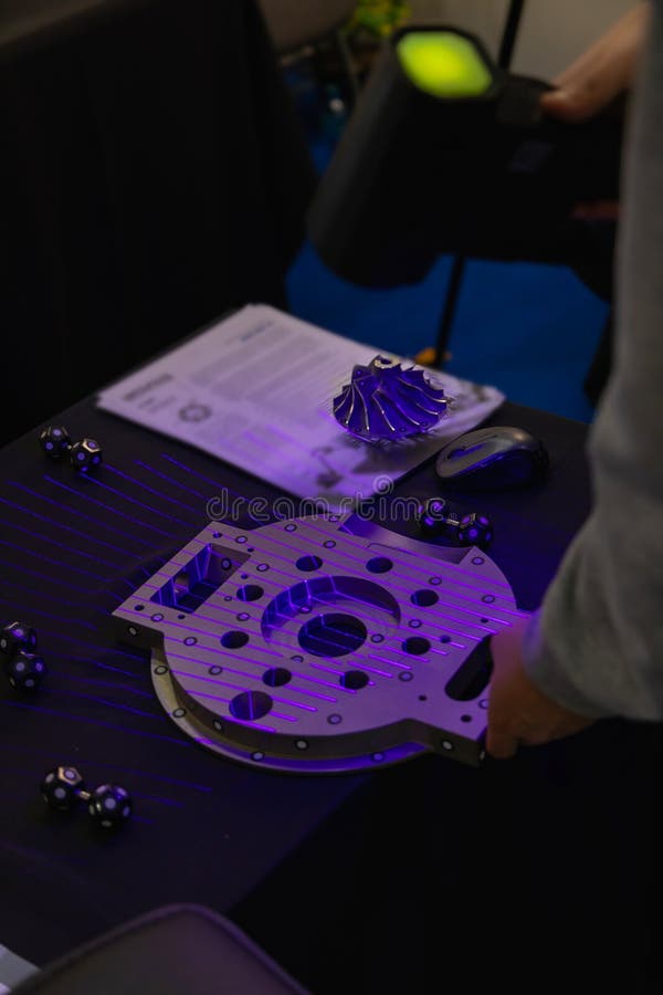 Engineer Measuring Mechanical Component with 3d Scanner Emitting Purple ...