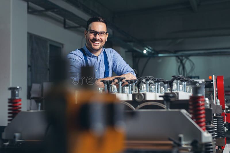 Mechanical Engineer Working on Machines. Stock Image - Image of ...