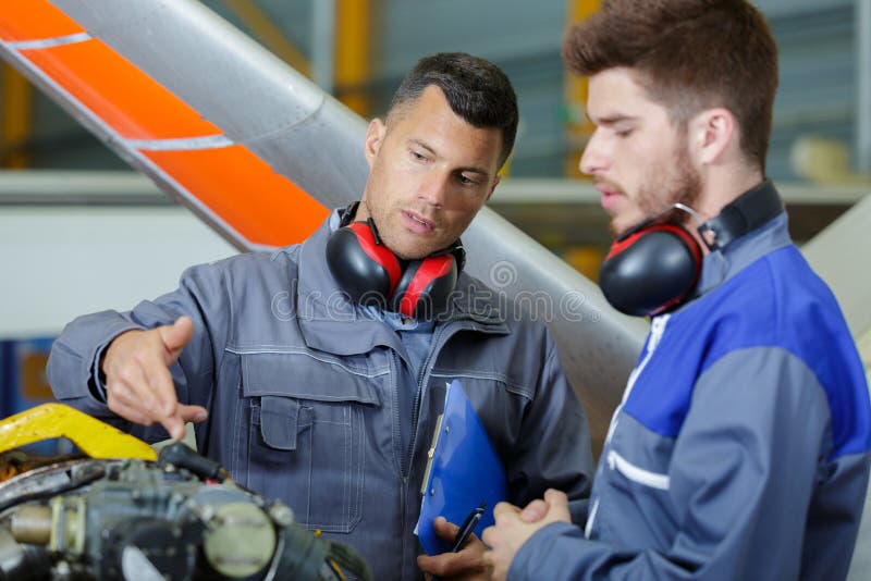 Mechanical Engineering Apprentice with Teacher Stock Photo - Image of ...