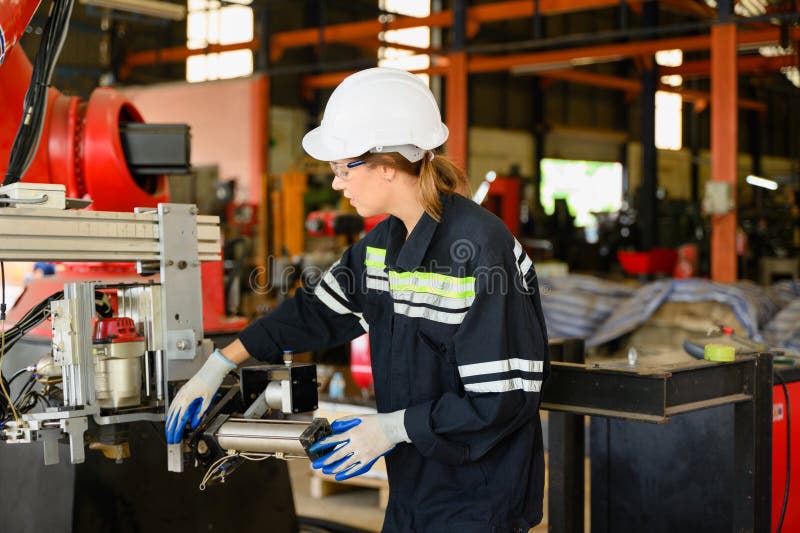 Mechanical Engineers Repairing Engine Machine at Factory Stock Photo ...