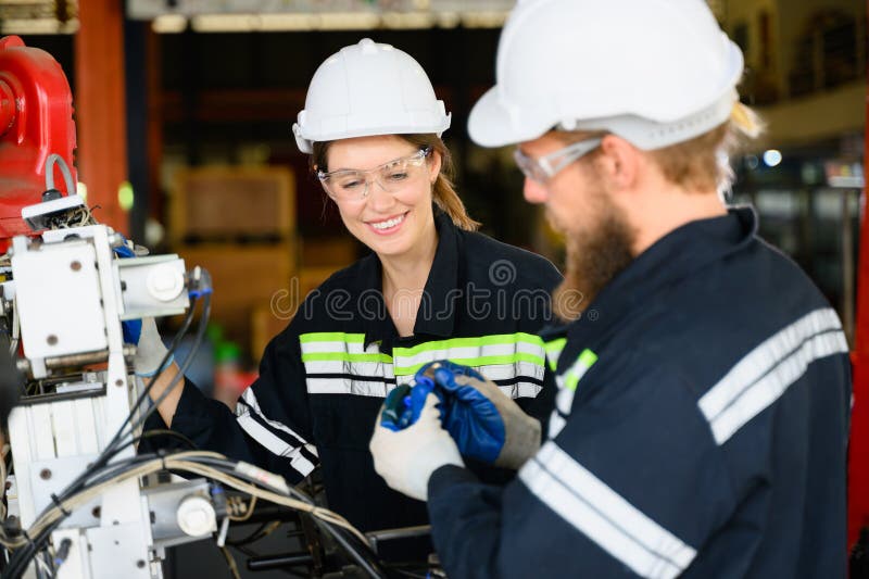 Mechanical Engineers Repairing Engine Machine at Factory Stock Photo ...