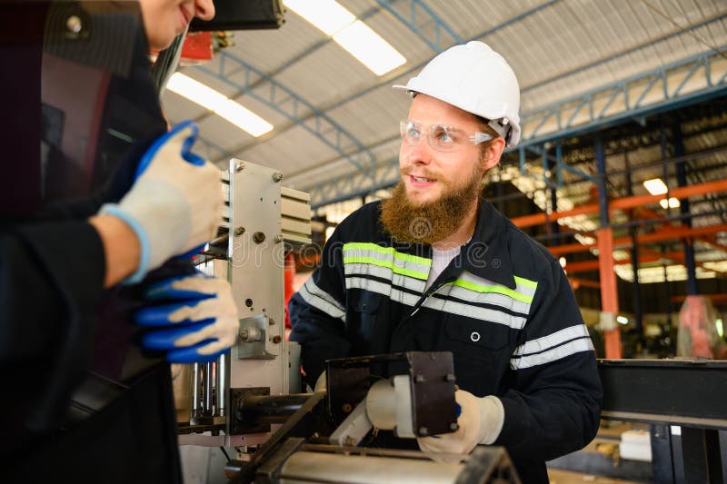 Mechanical Engineers Repairing Engine Machine at Factory Stock Photo ...