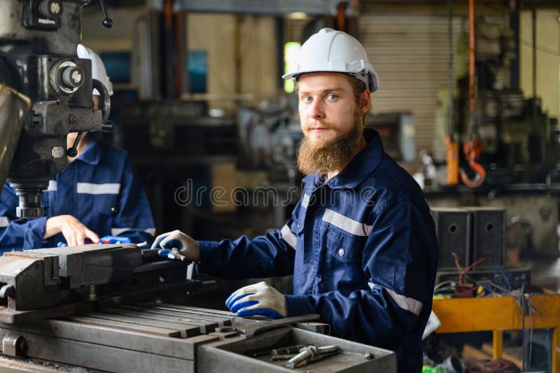 Mechanical Engineers Repairing Engine Machine at Factory Stock Photo ...