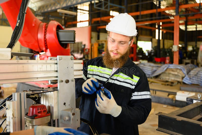 Mechanical Engineers Repairing Engine Machine at Factory Stock Photo ...