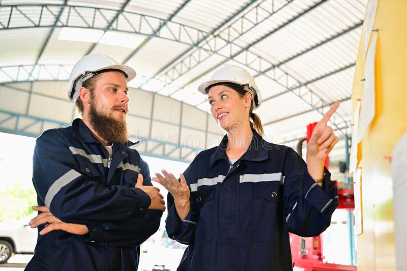 Mechanical Engineers Repairing Engine Machine at Factory Stock Image ...