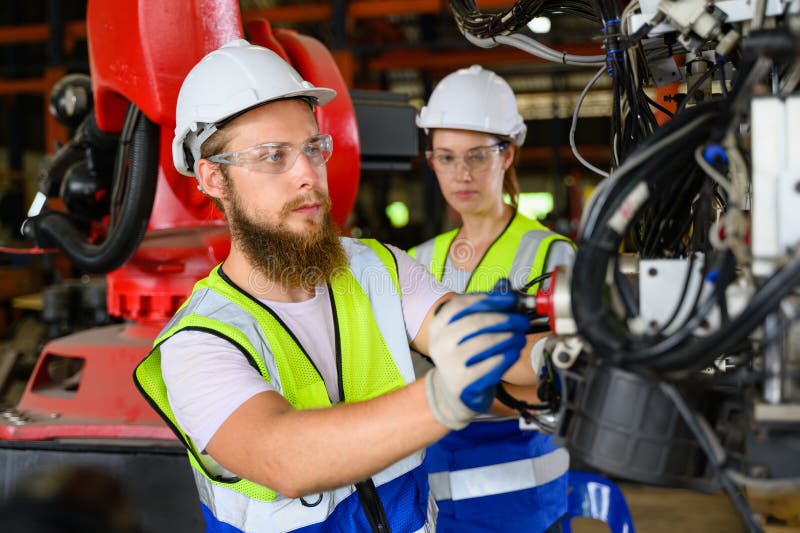 Mechanical Engineers Repairing Engine Machine at Factory Stock Image ...