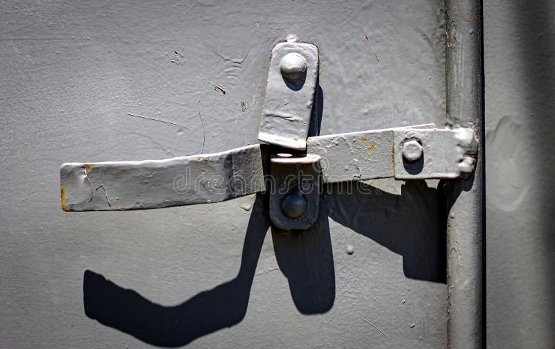 The Latch is Composed of Flat Metal Bars Joined Together, Forming a ...