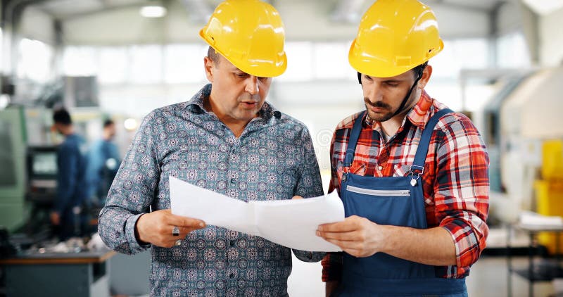 Supplier with Engineer Checking on Production in Factory Stock Photo ...