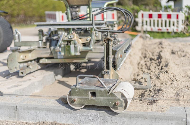 Mechanical Paving Installation Paving Machine on the Pavement Stock ...