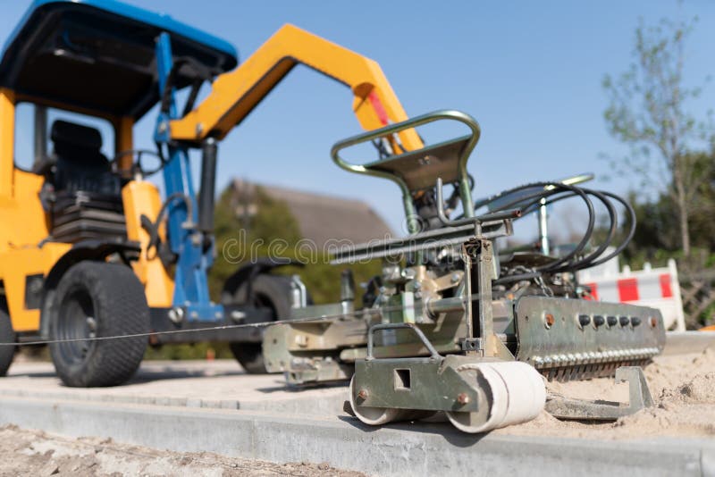 Mechanical Paving Installation Paving Machine on the Pavement Stock ...