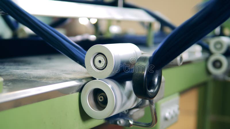 Mechanical Rollers with Coloured Yarn Going between Them. Textile ...