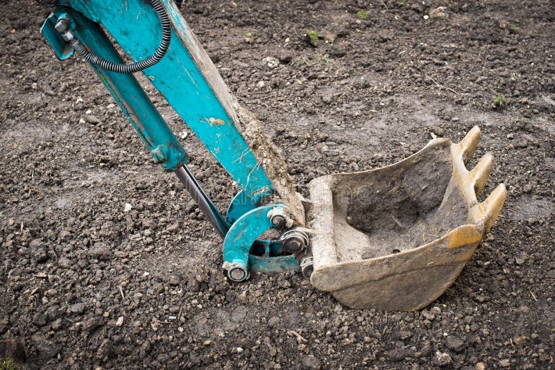 Mechanical Shovel in Close Up Unloading Earth Stock Image - Image of ...