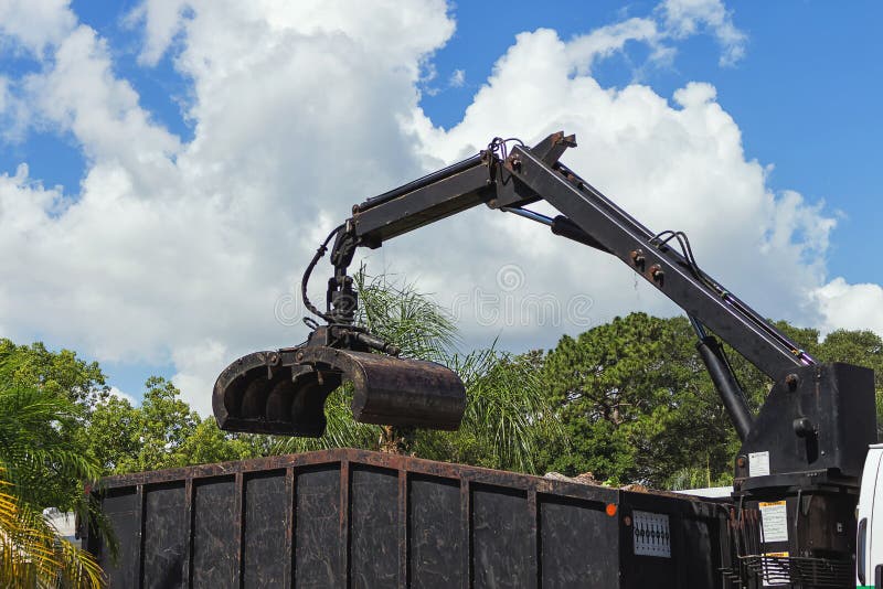 Mechanical Shovel In Close Up Unloading Earth Stock Image - Image of ...