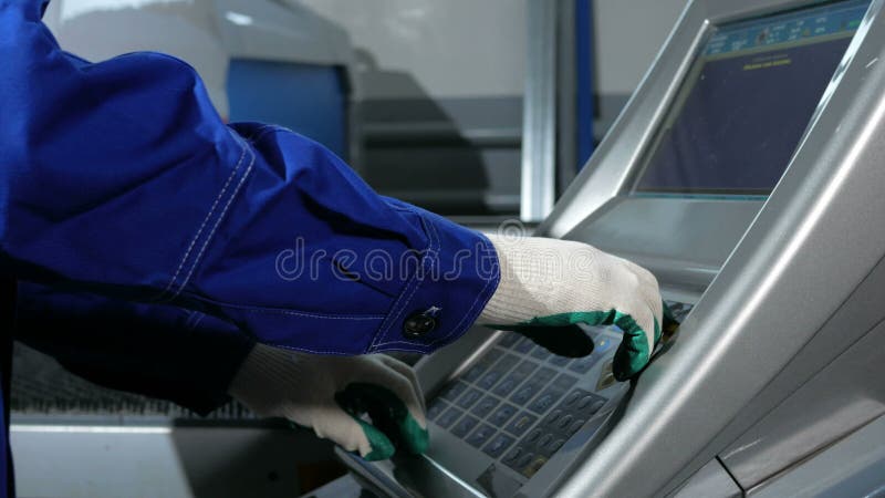 Mechanical Technician Programming Punching the Machine CNC. a Man ...