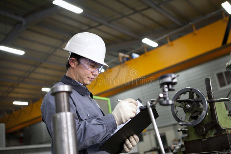 Mechanical Technician Writing on Notepad Stock Image - Image of lathe ...