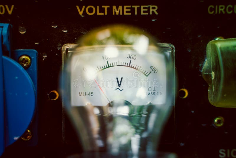 Mechanical Voltmeter through a Light Bulb Close-up. Voltage Measuring ...
