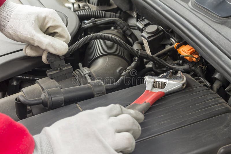 Mechanician Performing Maintenance on a Car Engine Stock Image - Image ...