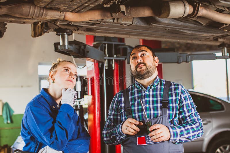 Two Mechanics Discussing Problem Stock Image - Image of occupation ...