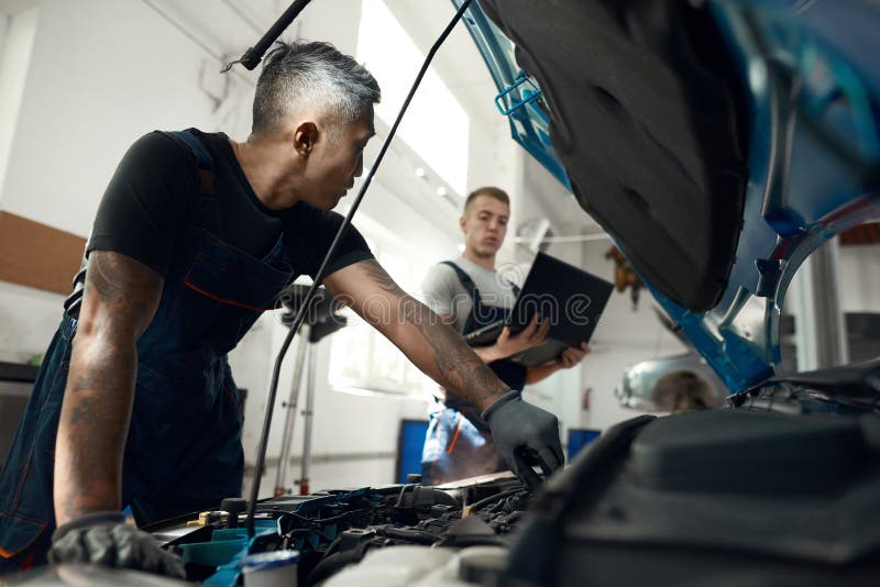 Mechanics Doing Computer Diagnostic of Car Engine Stock Photo - Image ...