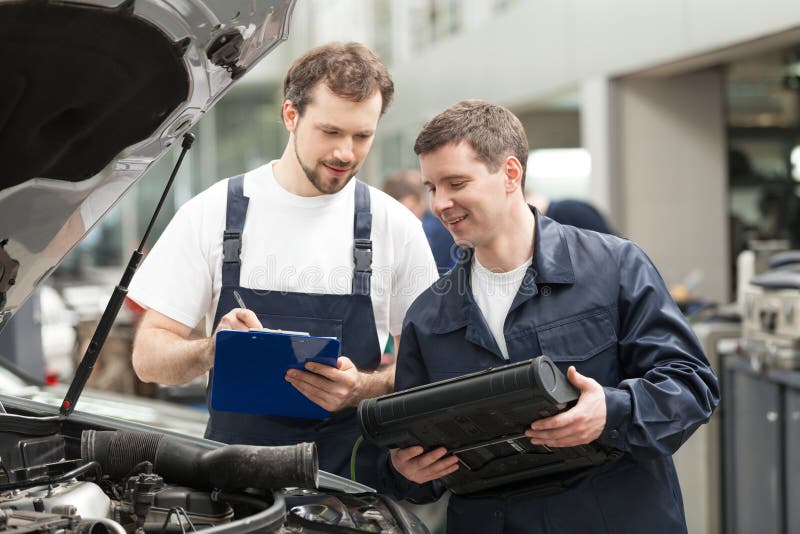 Mechanics at work shop. stock image. Image of people - 32808701