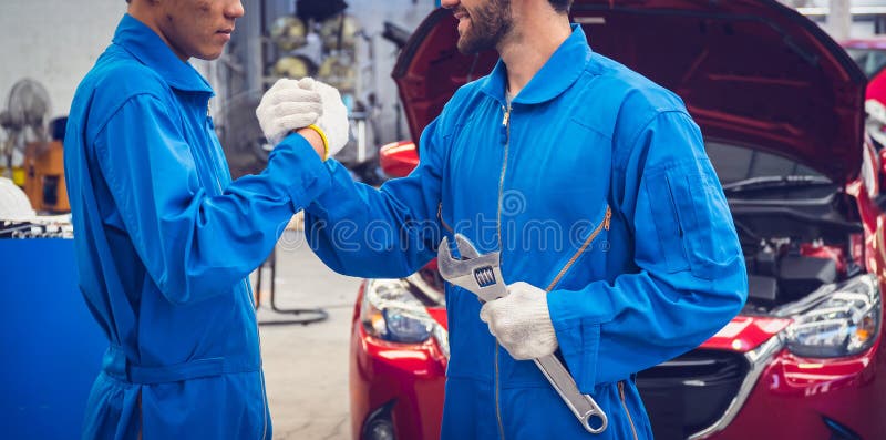 Mechanics Working in the Workshop Garage. Team Work Concepts Stock ...