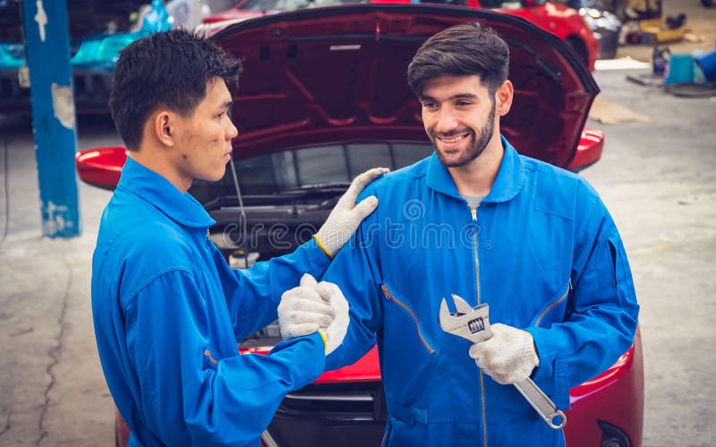 Mechanics Working in the Workshop Garage. Team Work Concepts Stock ...
